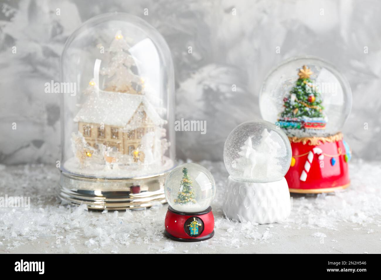 Set of different beautiful snow globes on table Stock Photo - Alamy