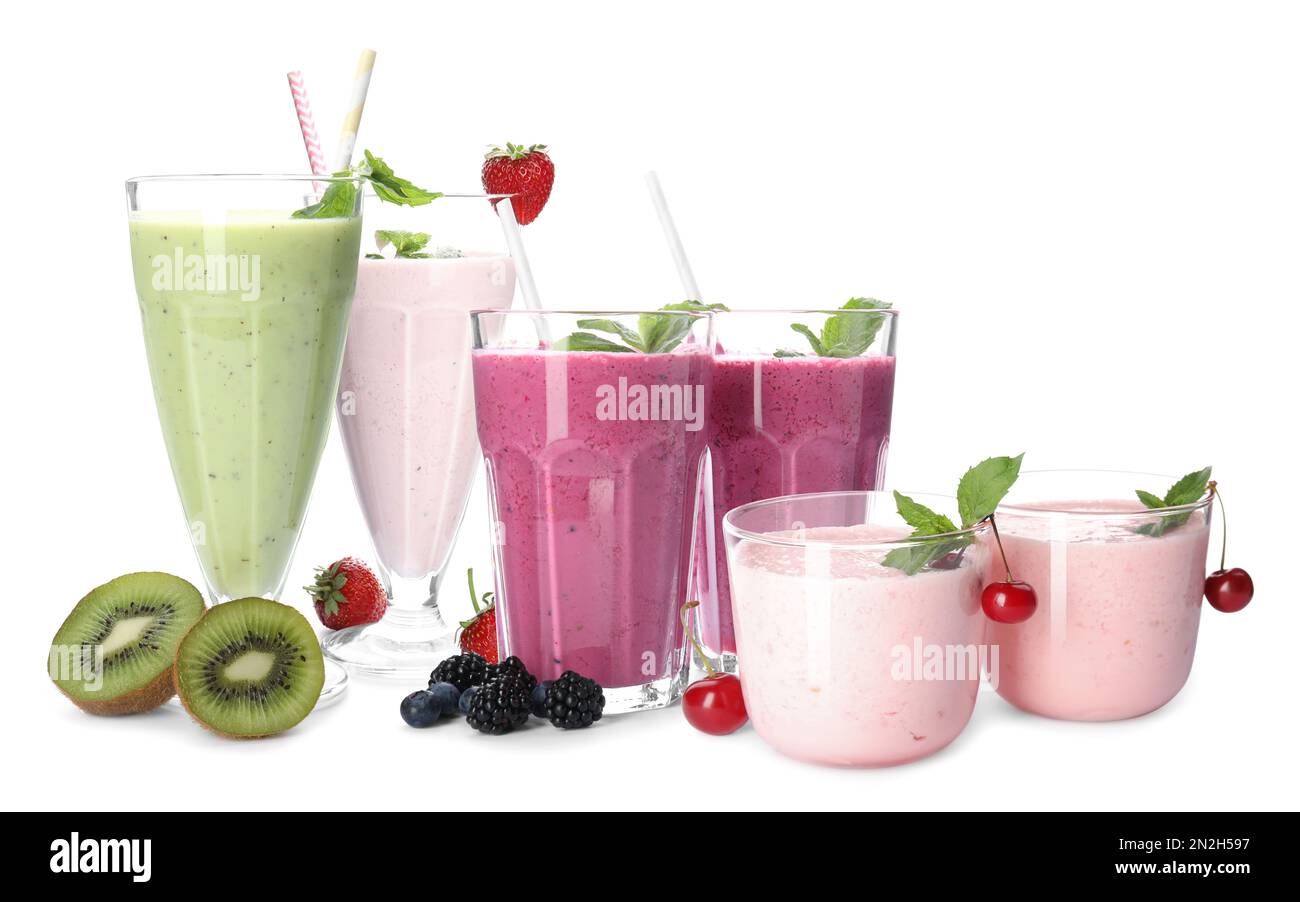 Different tasty milk shakes on white background Stock Photo - Alamy