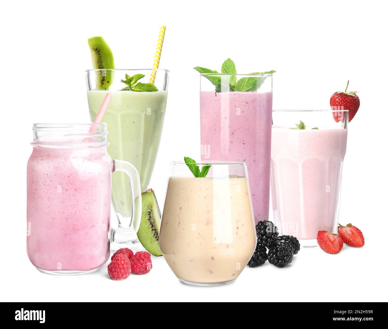 Different tasty milk shakes on white background Stock Photo - Alamy