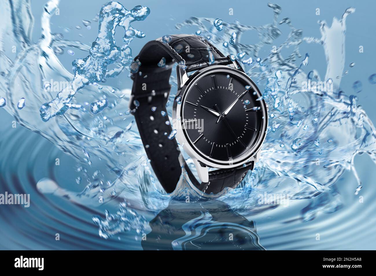 Luxury men's watch in water splashes demonstrating its waterproof Stock ...