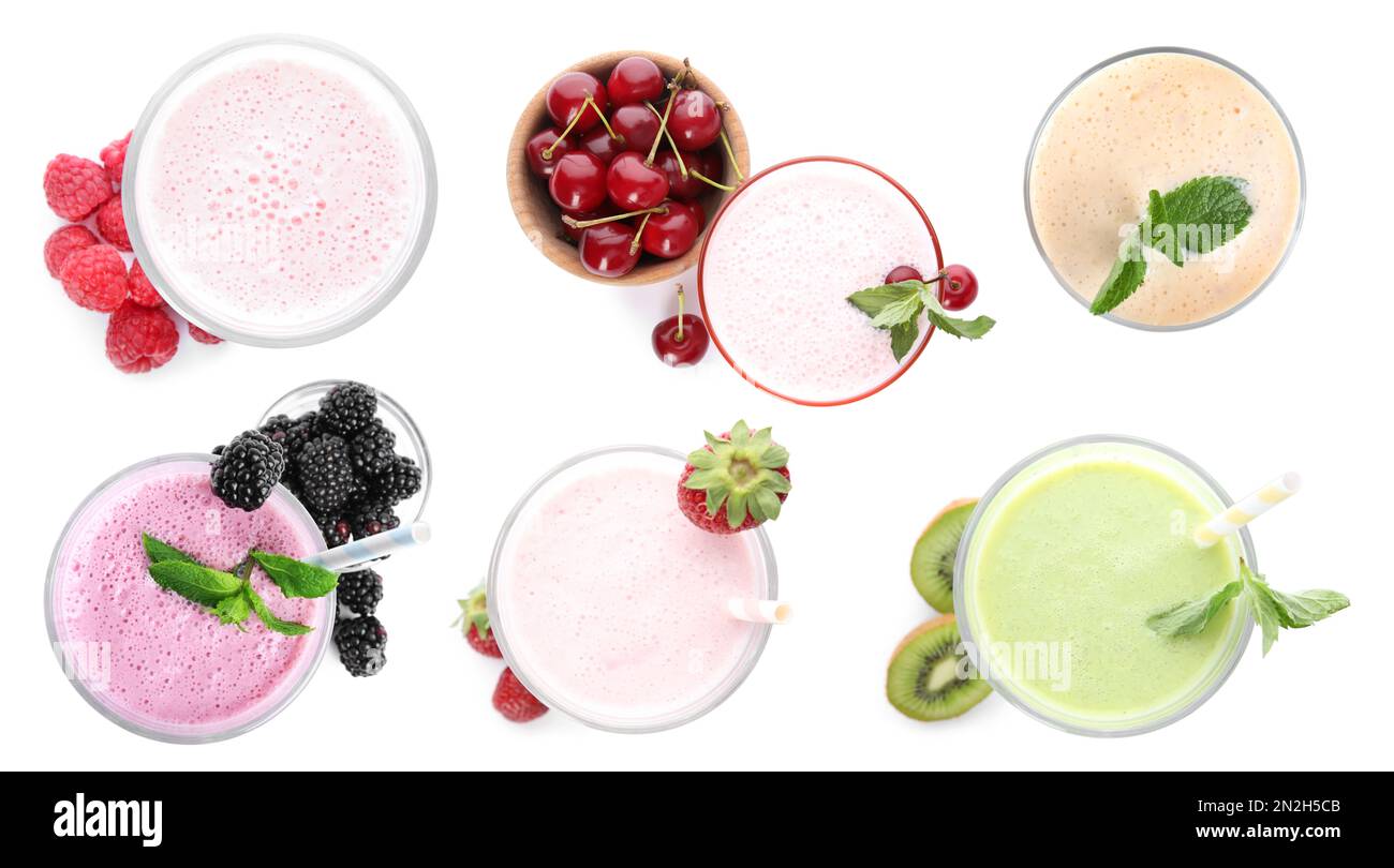 Set of different tasty milk shakes on white background, top view ...