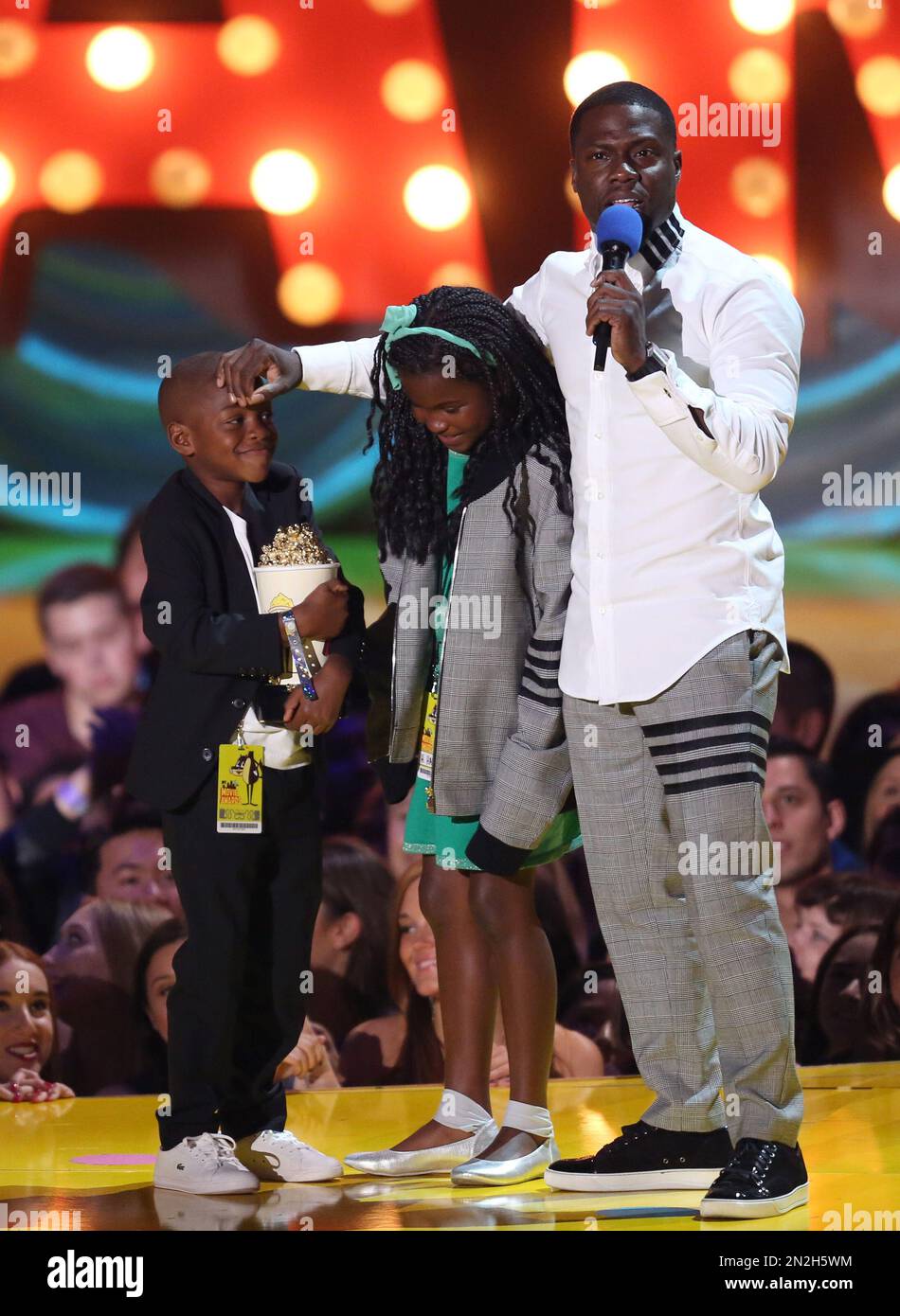 Kevin Hart, right, appears on stage with his kids Hendrix Hart, left ...