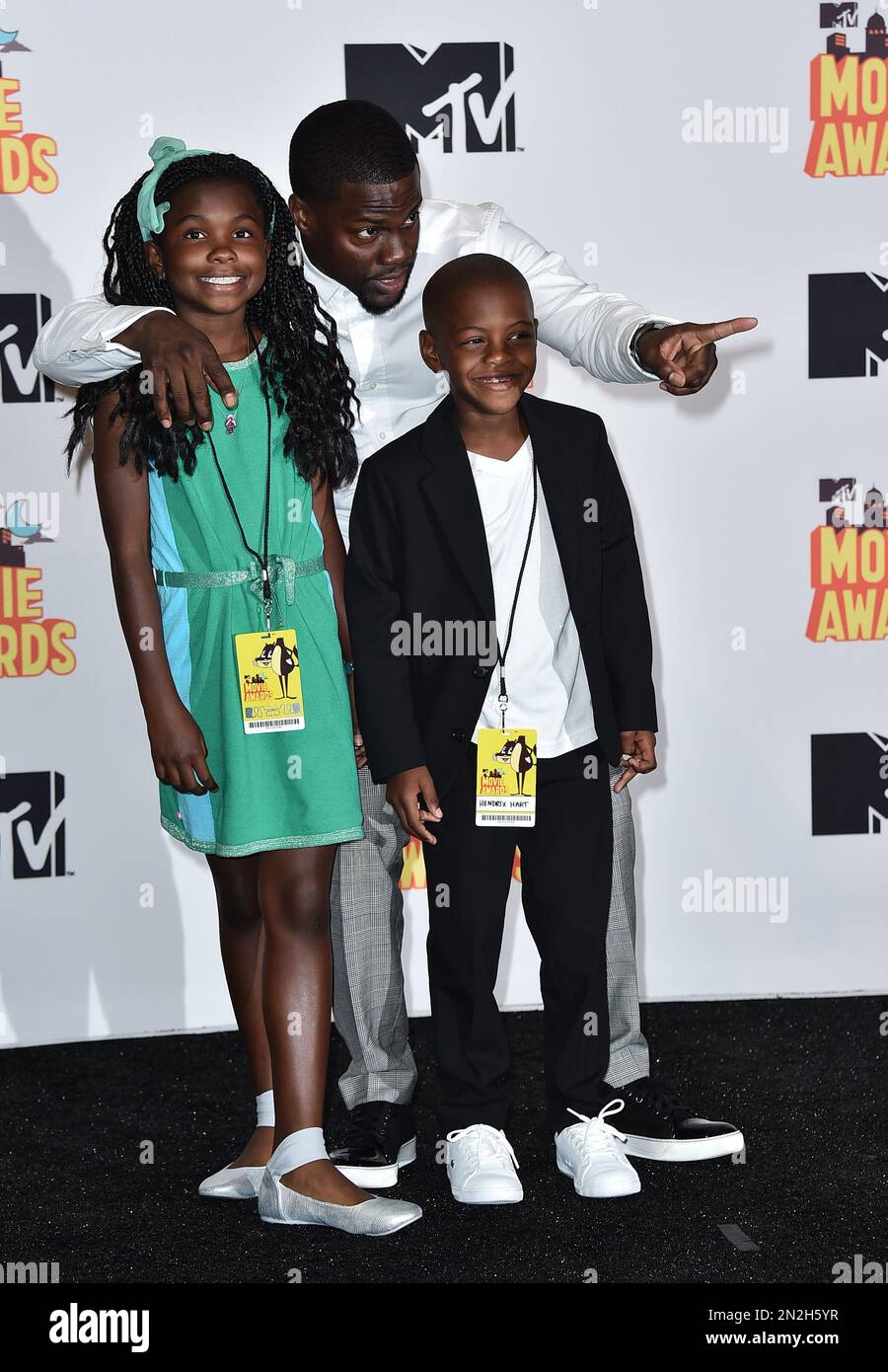 Kevin Hart, winner of the comedic genius award, poses in the press room ...