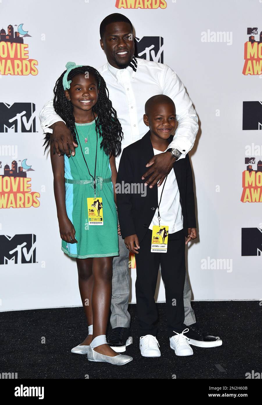 Kevin Hart, winner of the comedic genius award, poses in the press room ...
