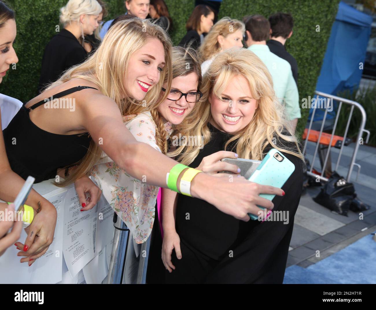 Rebel Wilson takes a selfie with fans as she arrives at the MTV Movie ...