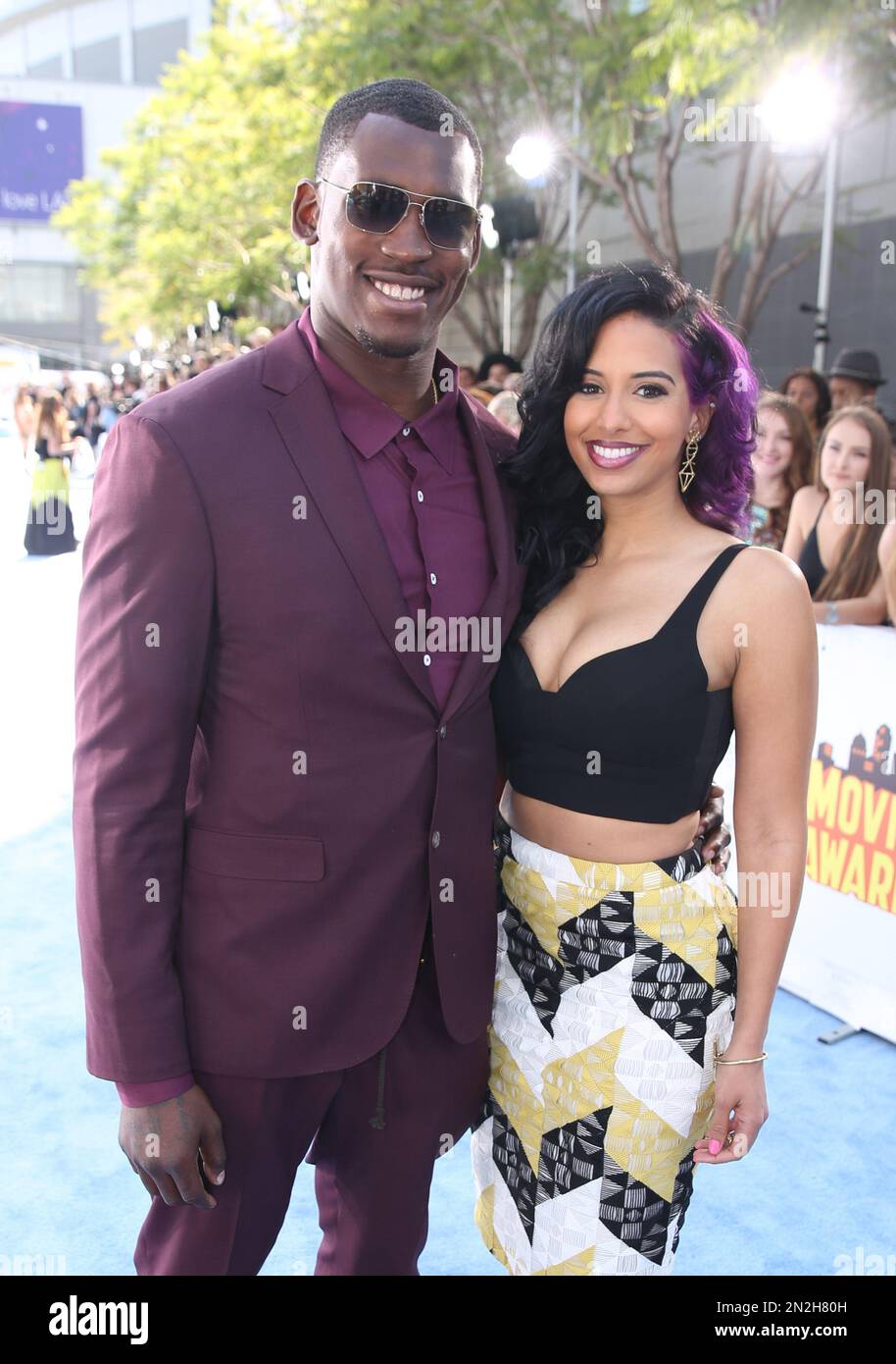 Aldon Smith, left, and Nessa arrive at the MTV Movie Awards at the ...