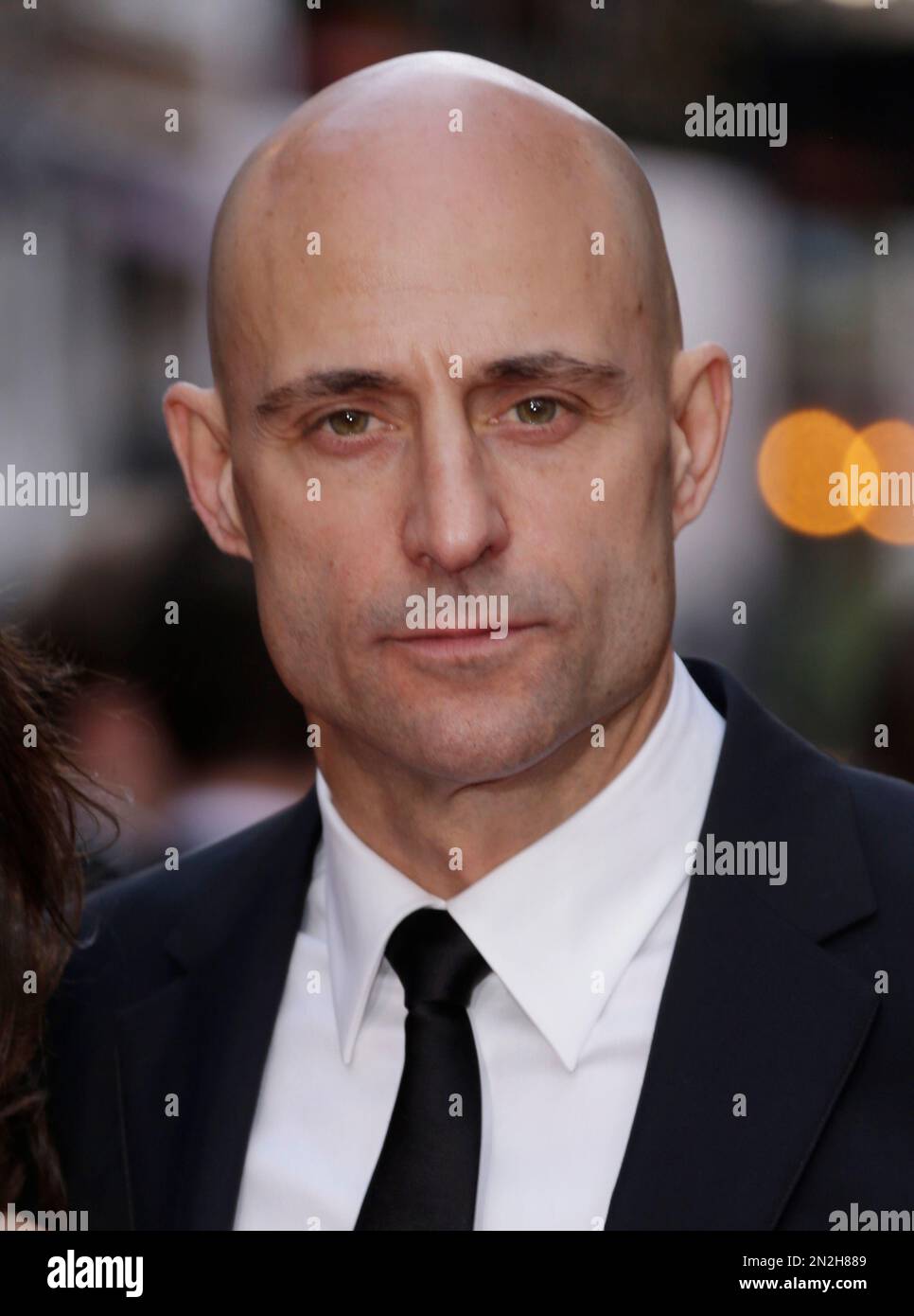 Actor Mark Strong poses for photographers upon arrival at the Olivier ...