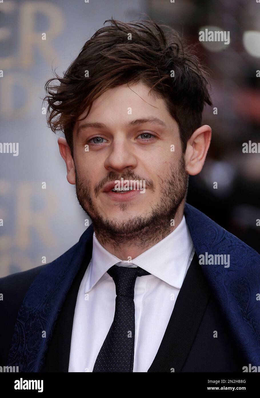 Iwan Rheon poses for photographers upon arrival at the Olivier Awards ...
