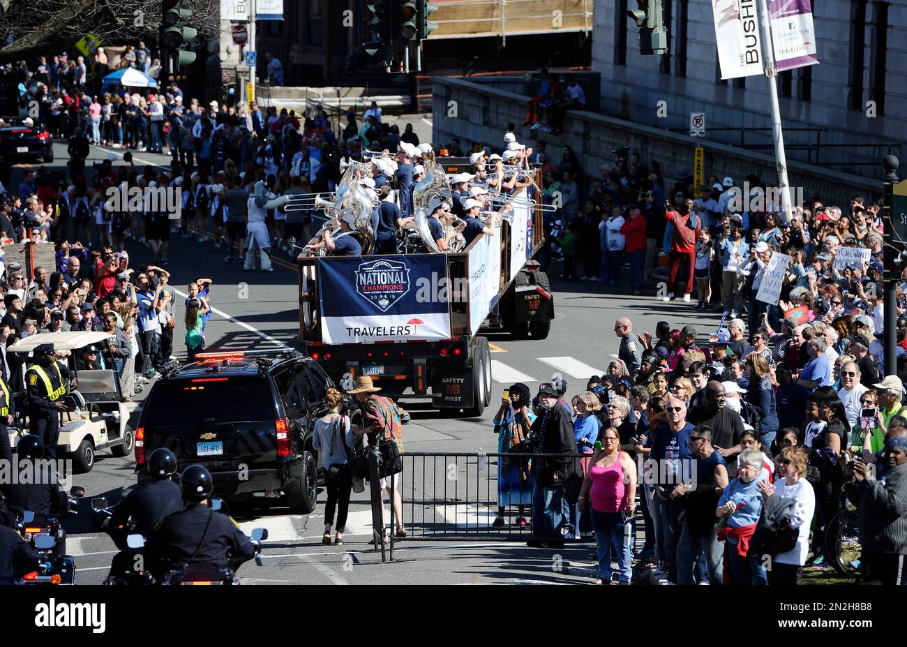 The Connecticut band plays on a float between fans during a parade ...