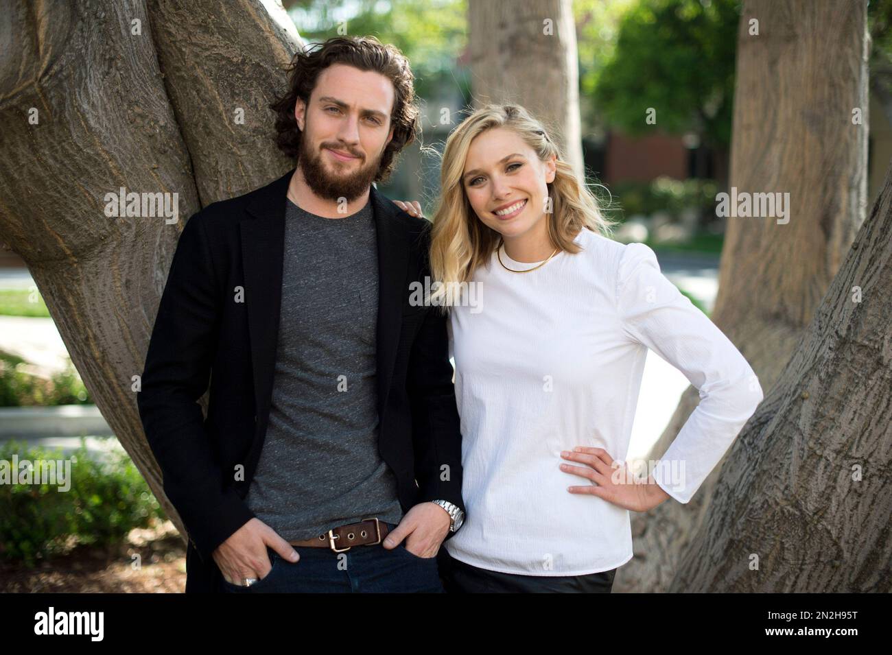 Aaron Taylor-Johnson, left, and Elizabeth Olsen pose during a portrait ...