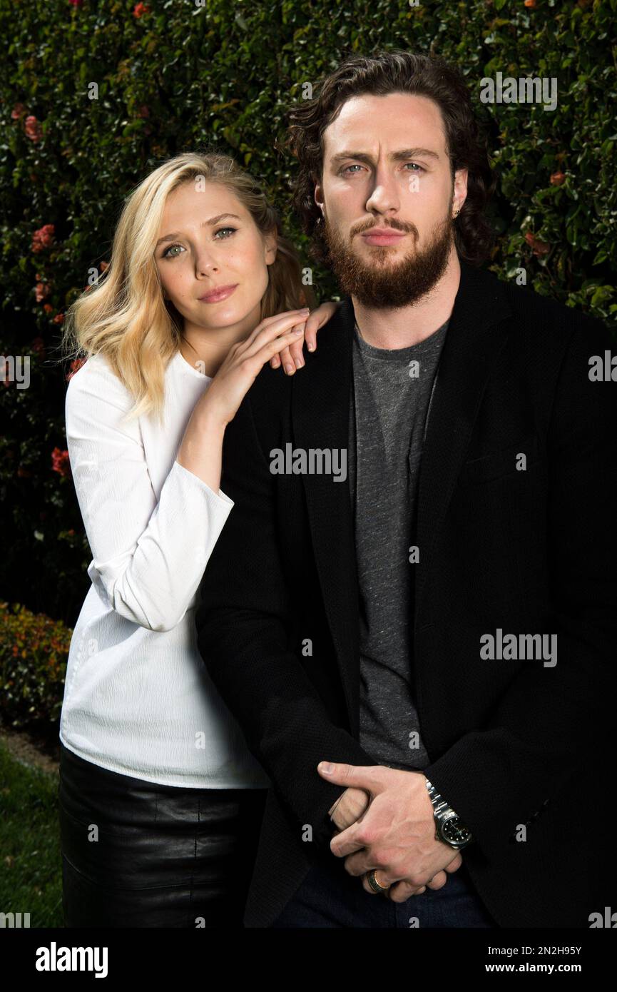 Elizabeth Olsen, left, and Aaron Taylor-Johnson pose during a portrait ...