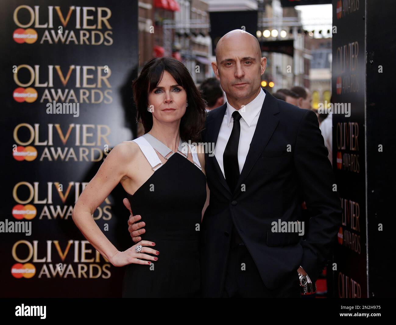 Actor Mark Strong, right, and wife Liza Marshall pose for photographers ...