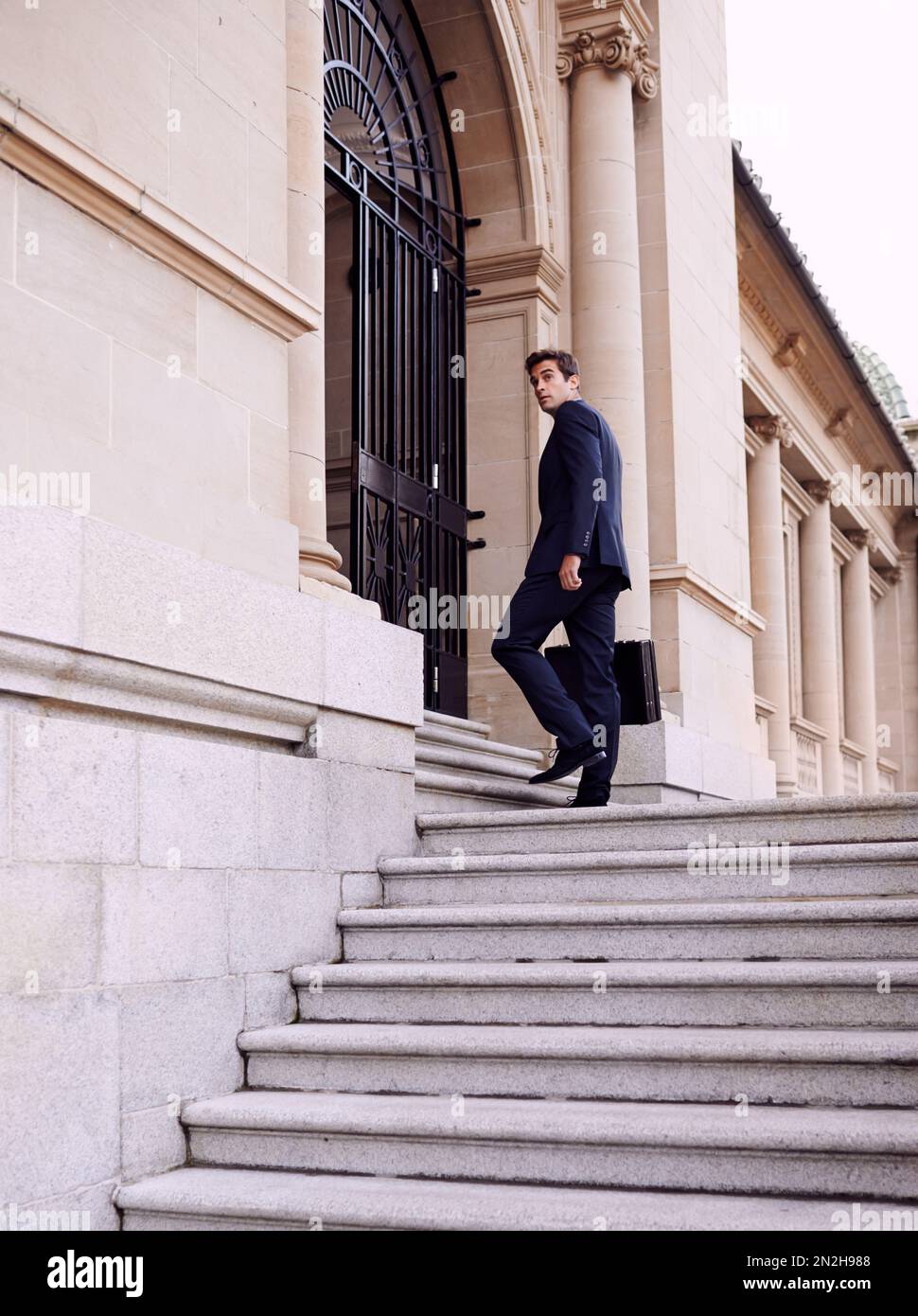 Always the first to arrive at the office...A handsome businessman with ...