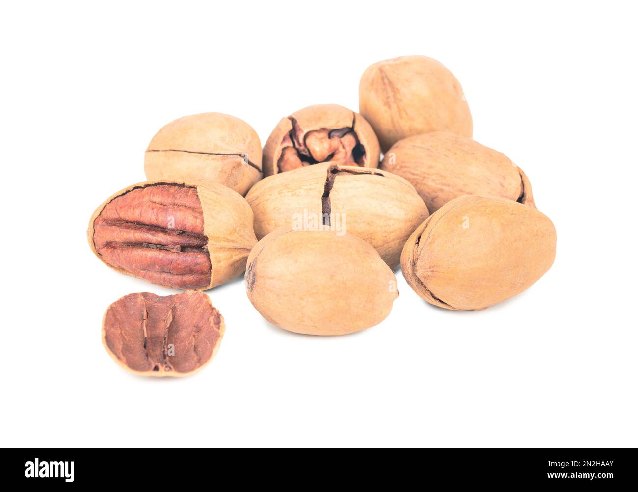 Bunch of inshell pecans on white background Stock Photo - Alamy