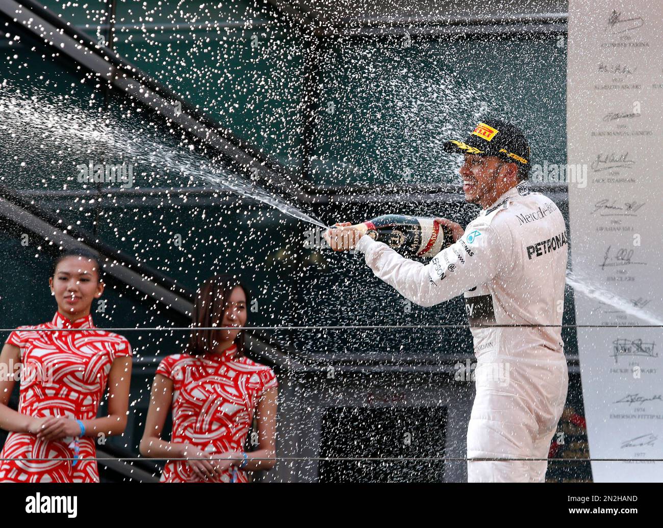 Mercedes driver Lewis Hamilton of Britain celebrates with champagne on ...
