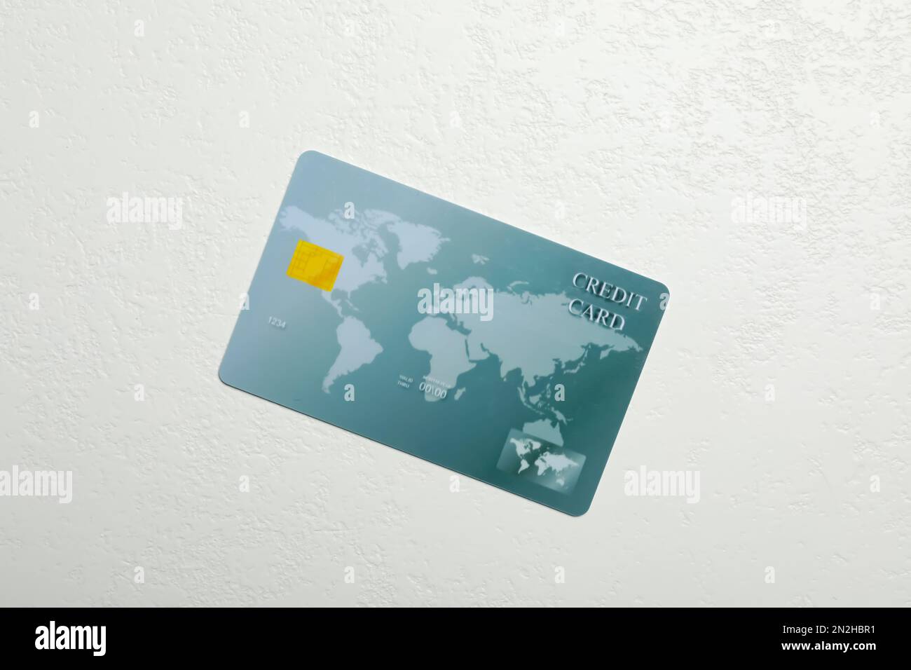 Credit card on white table, top view Stock Photo - Alamy