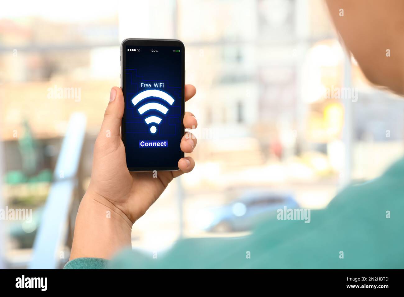 Man connecting to WiFi using mobile phone, closeup Stock Photo - Alamy