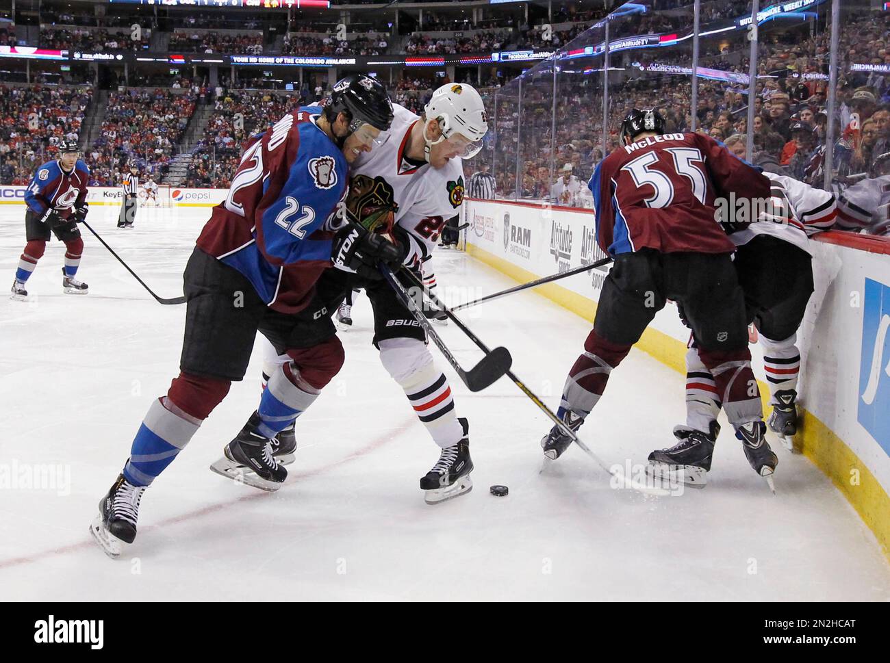 Colorado Avalanche defenseman Zach Redmond (22) and Chicago Blackhawks ...