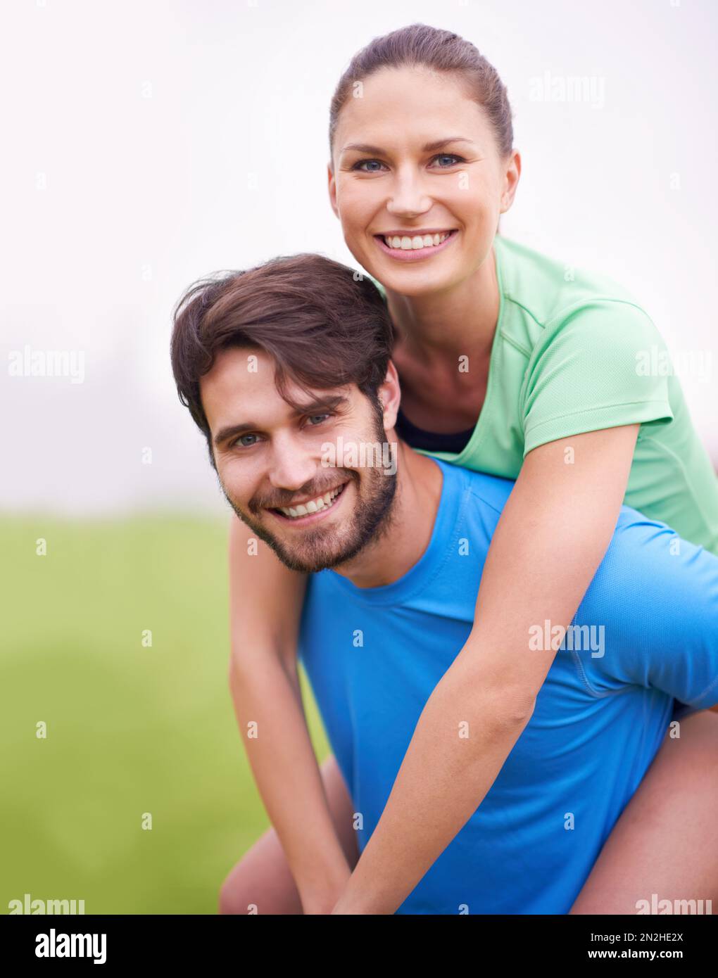 Always a good time when were together. a young man playfully carrying ...