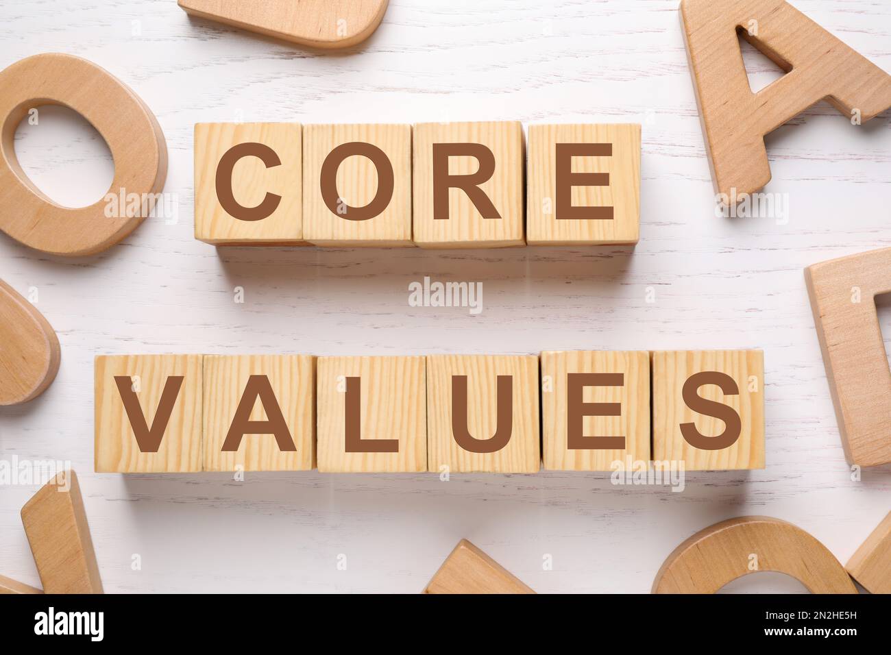 Cubes with phrase CORE VALUES on white wooden background, flat lay ...
