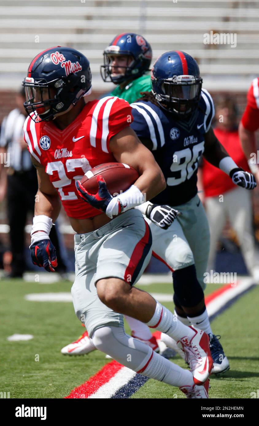 Mississippi Red Team running back Jordan Wilkins (22) runs past Blue ...