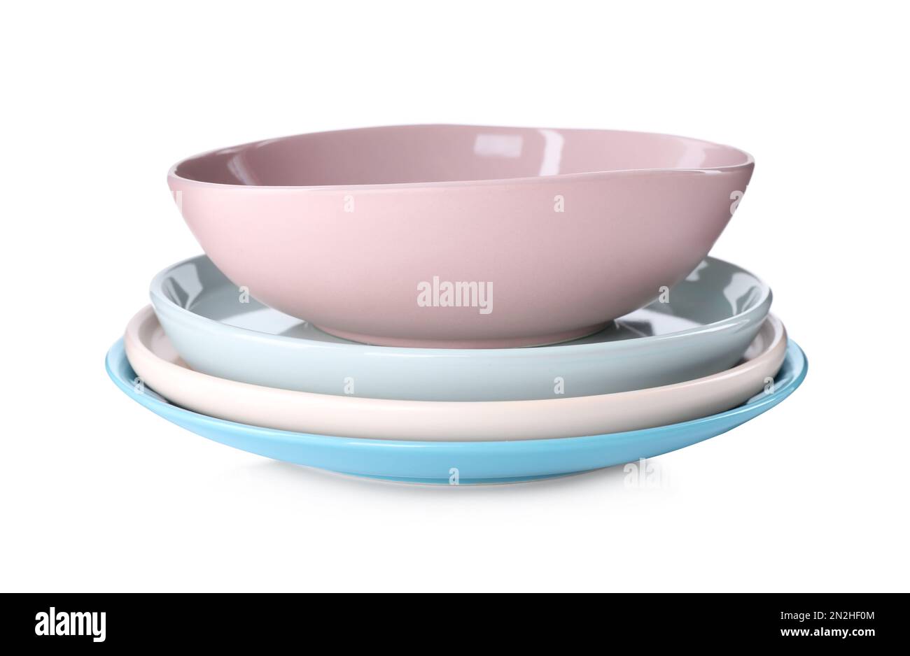 Stack of clean plates and bowl on white background Stock Photo - Alamy