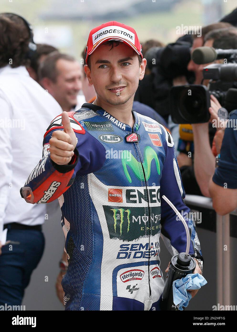 Jorge Lorenzo, of Spain, gives a thumbs-up fter his third-place finish ...