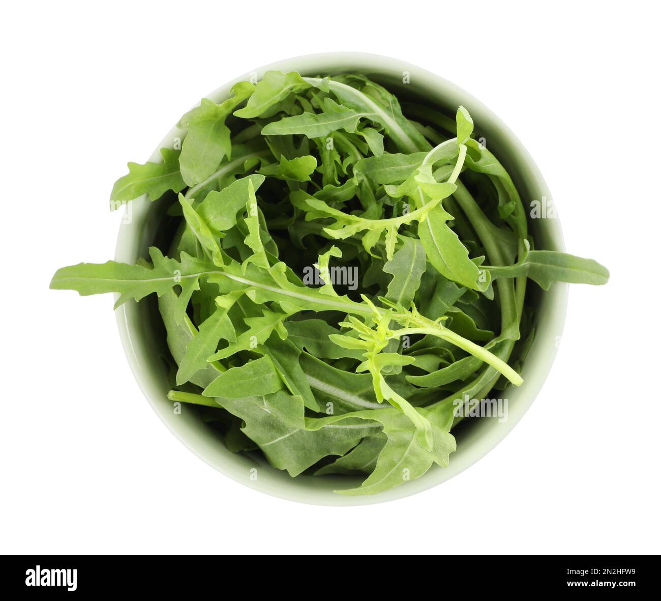 Delicious fresh arugula in bowl isolated on white, top view Stock Photo ...