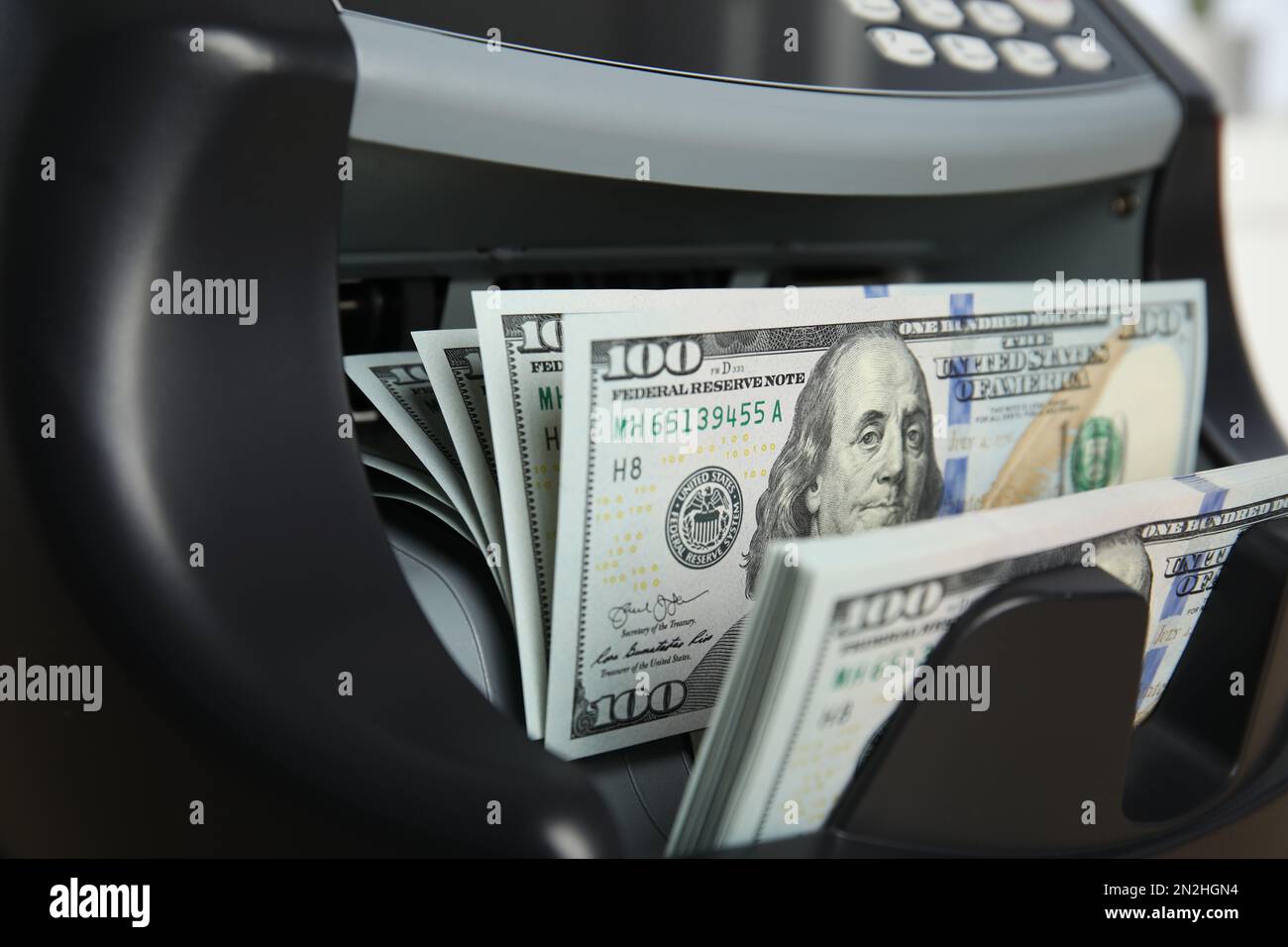 Modern electronic bill counter with money, closeup Stock Photo - Alamy