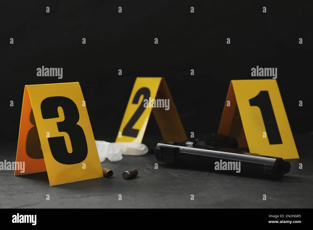 Crime scene markers and evidences on black background Stock Photo - Alamy