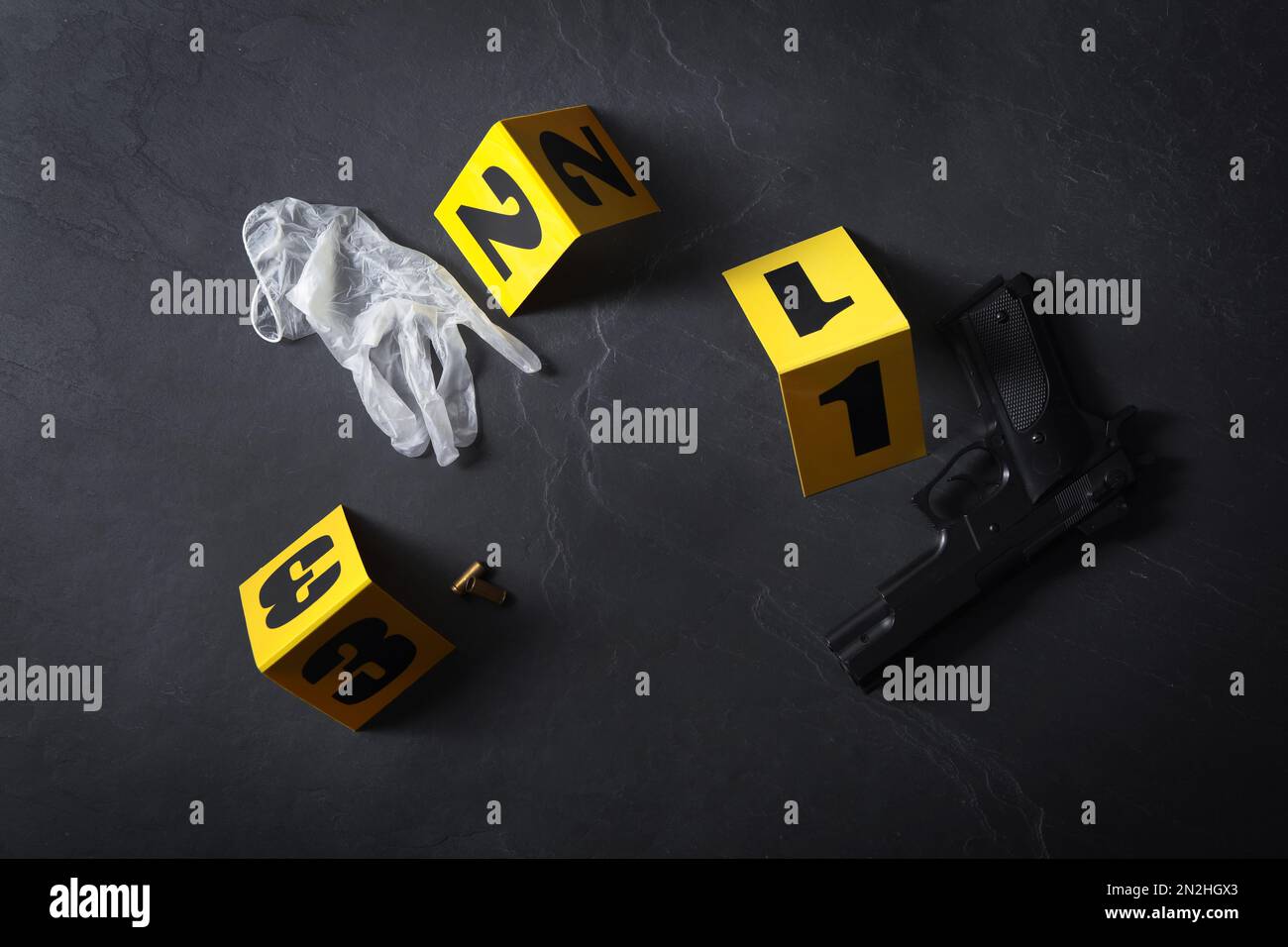 Flat lay composition with evidences and crime scene markers on black ...