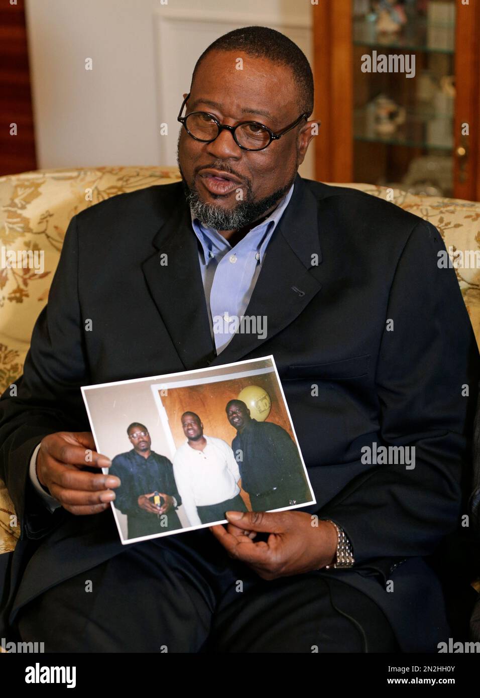 On this April 8, 2015 file photo, Anthony Scott holds a photo of ...