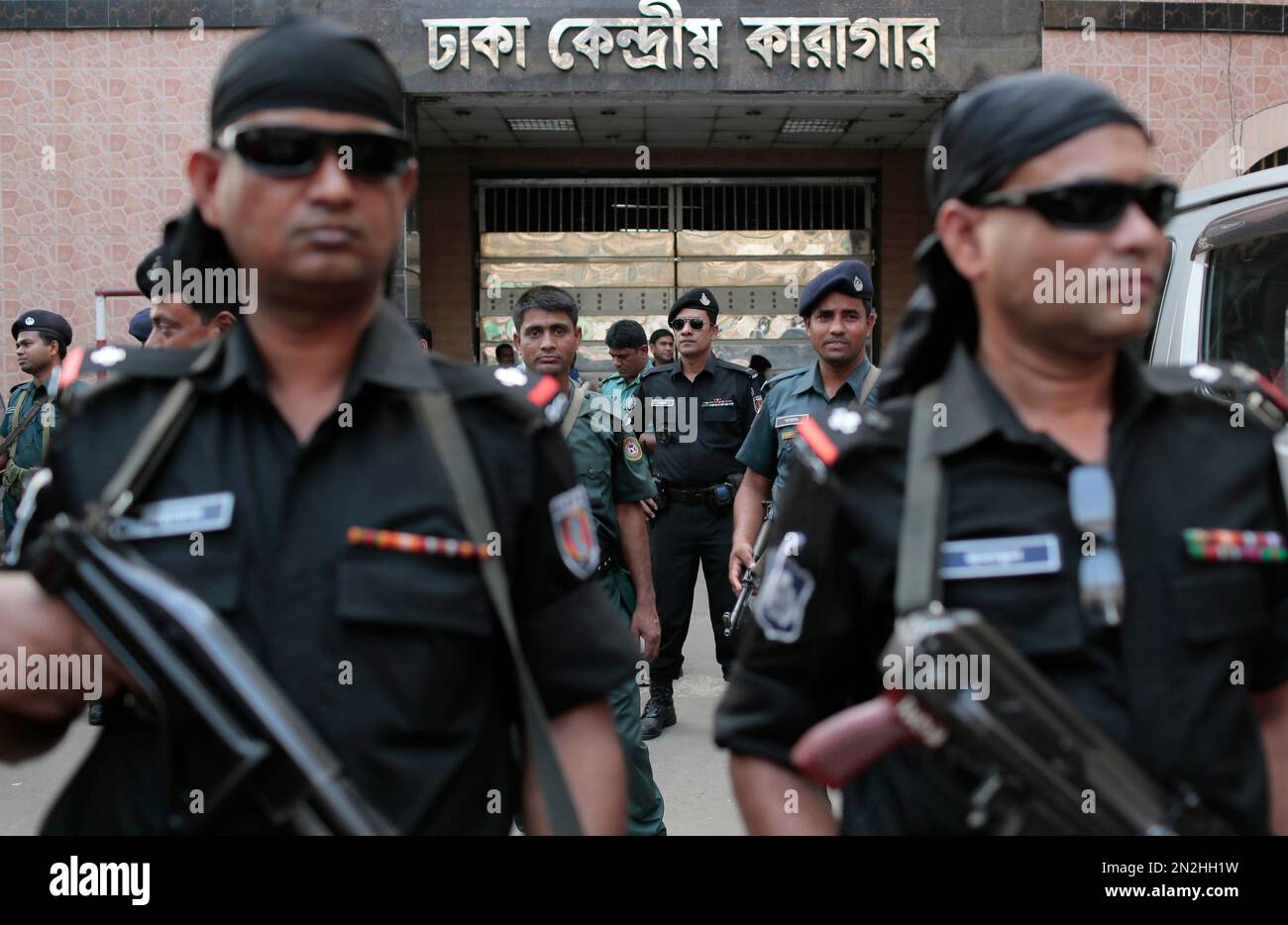 Bangladeshi security personnel stand guard outside Central Jail where ...