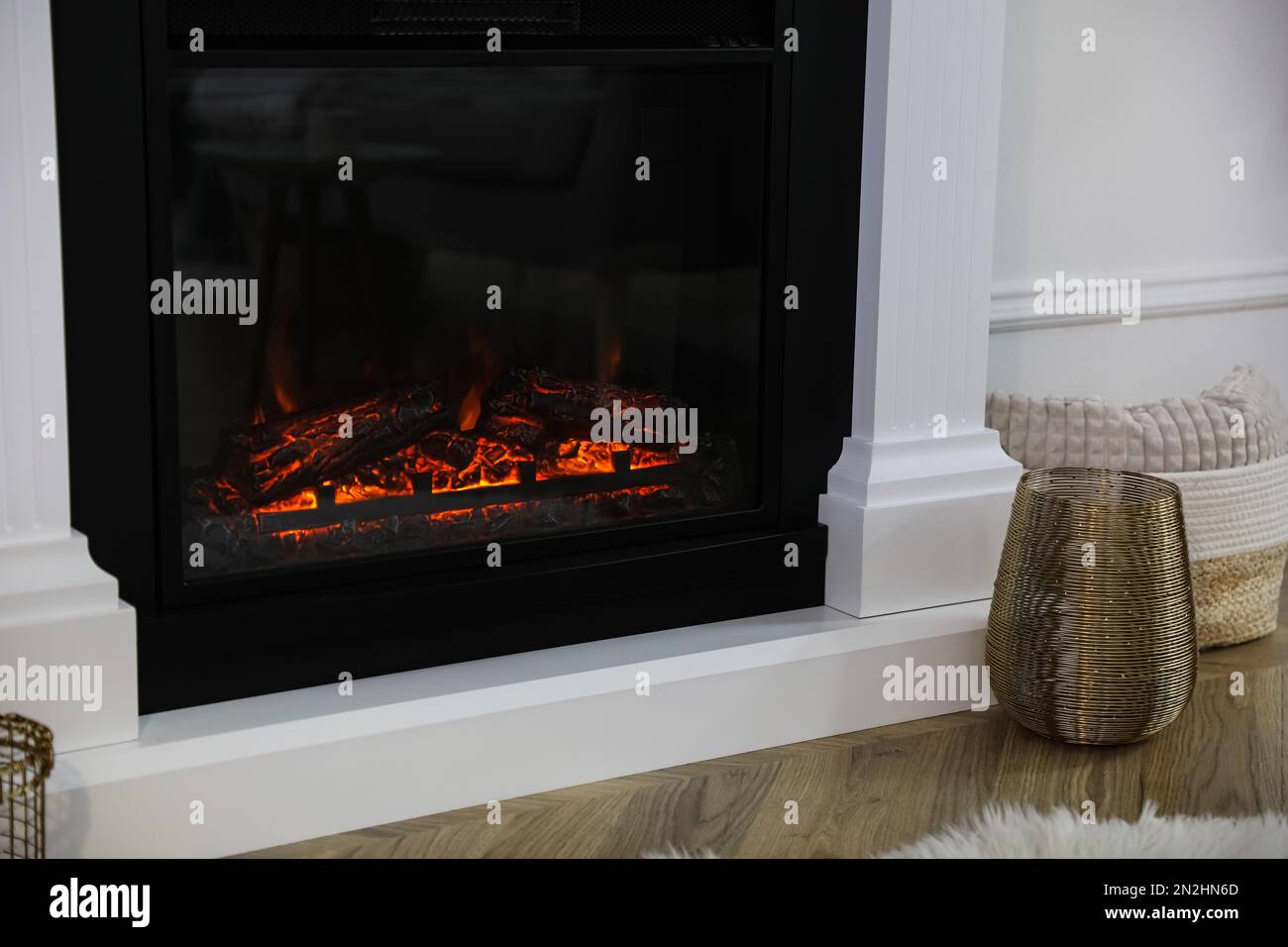 Modern fireplace in room, closeup. Interior design Stock Photo - Alamy