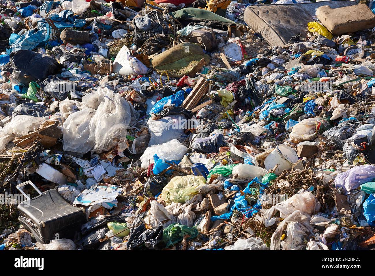 Open air garbage dump. Plastic pollution. Recycling junk. Consumerism ...