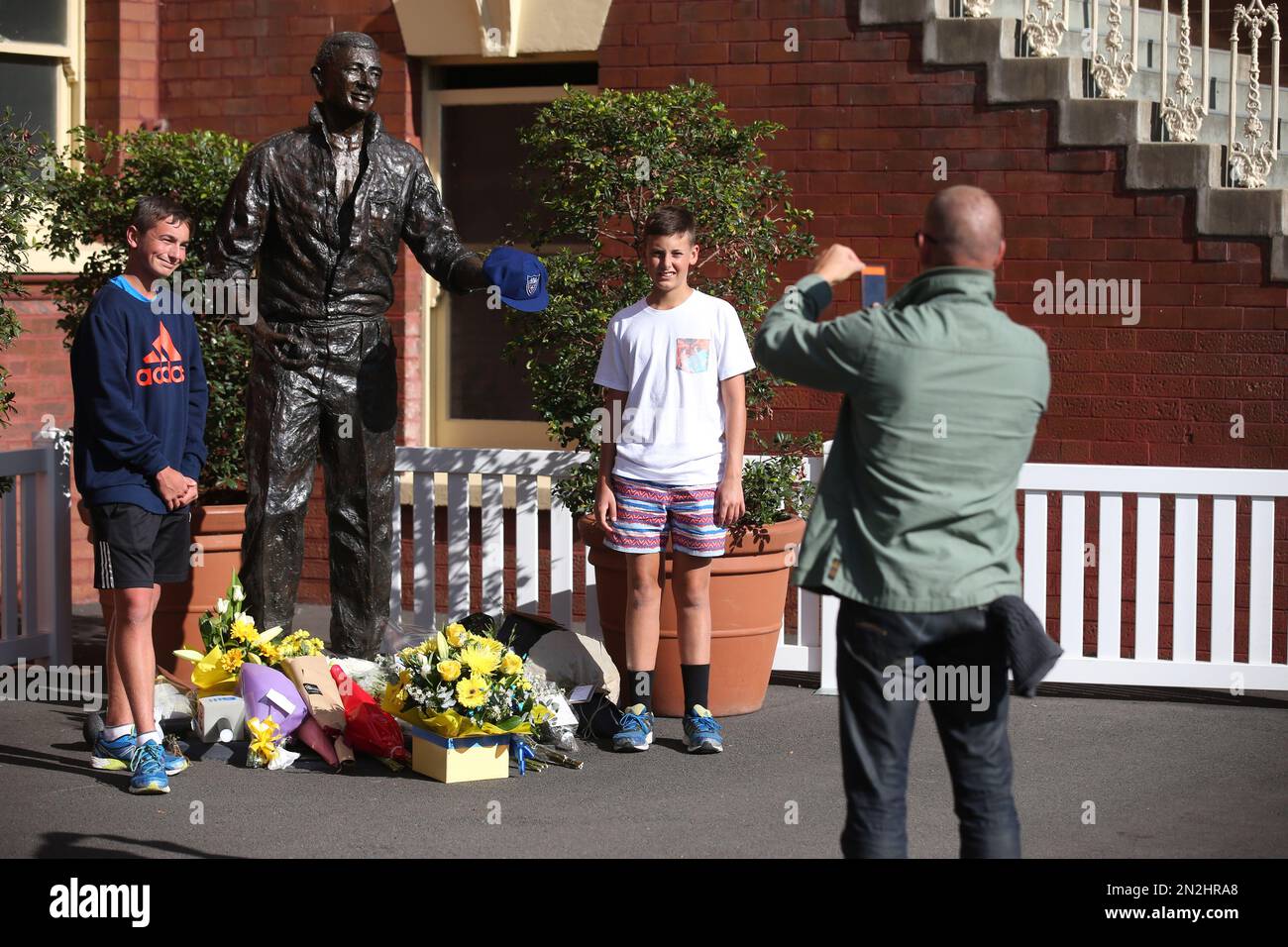 Ian Coker, right, photographs his son Ben Coker, left, and his friend ...