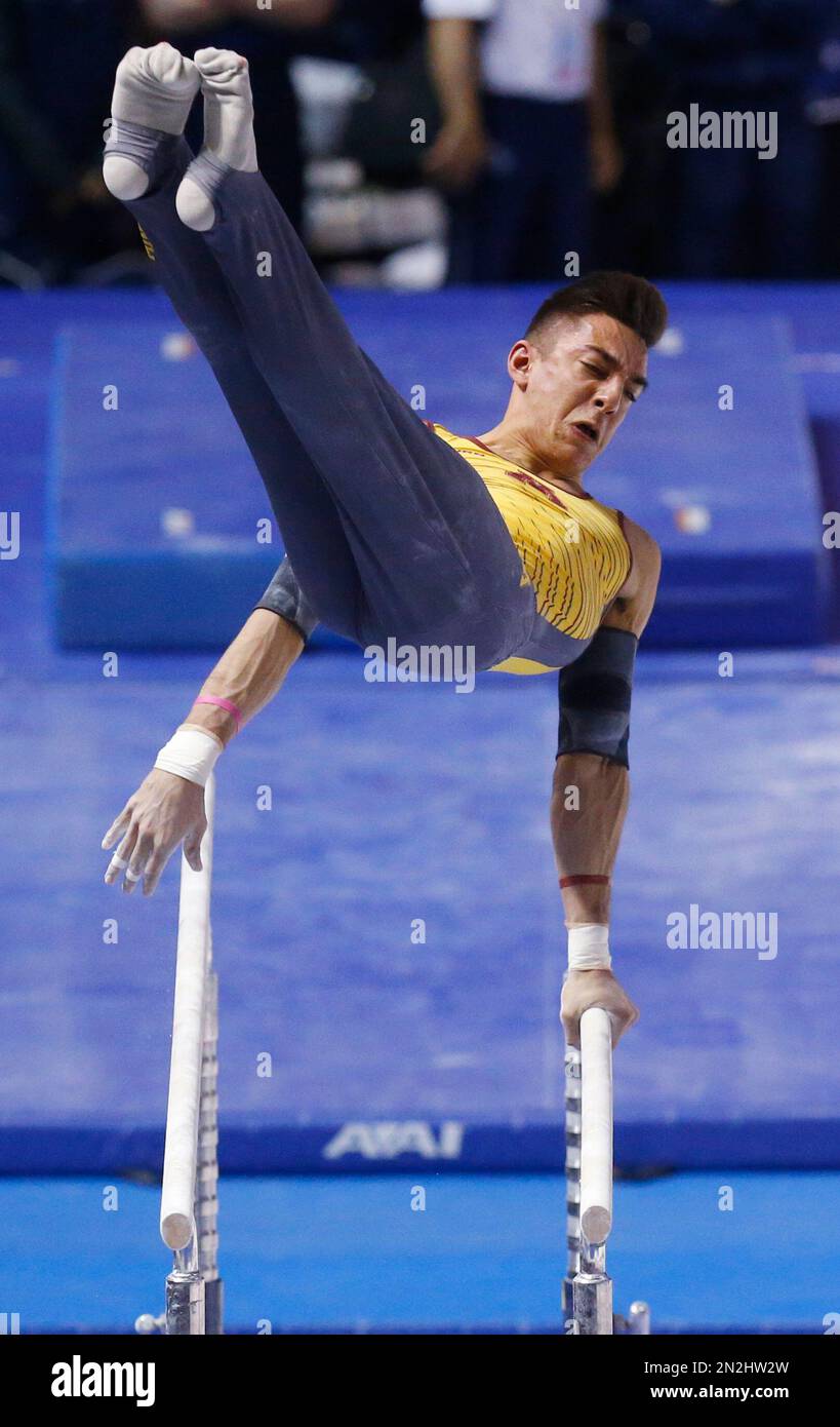 Minnesota's Steve Jaciuk competes on the parallel bars during the ...