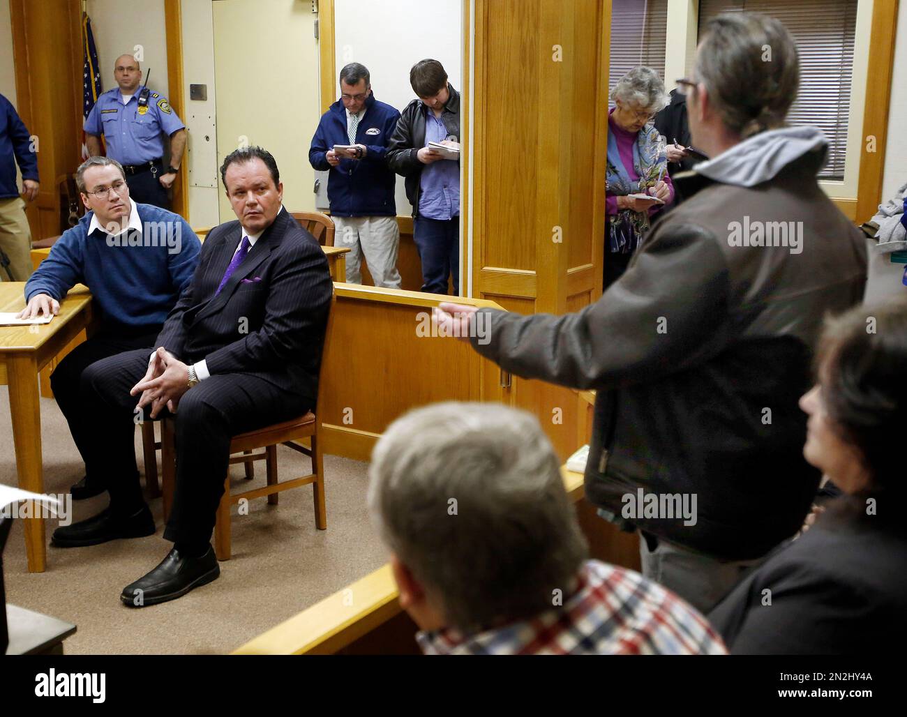 Dean Smart, brother of Gregory Smart, speaks to Patrick Randall, left, with his attorney Mark ...