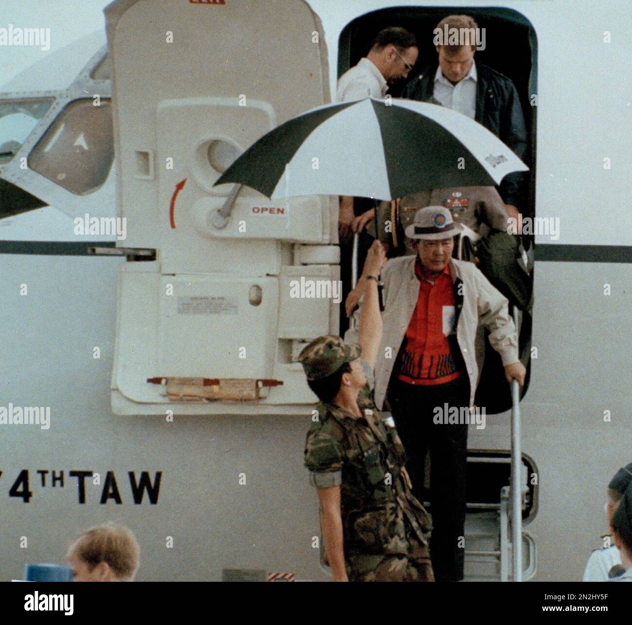 Ferdinand Marcos arrives at Guam after leaving the Philippines, Feb. 26 ...