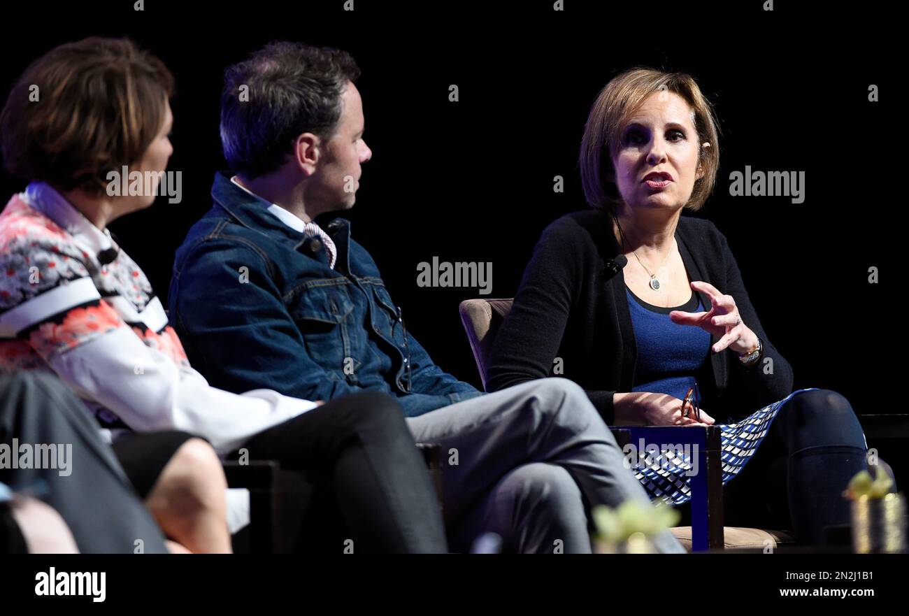 Panelist Michelle King, right, answers a question as fellow panelists ...