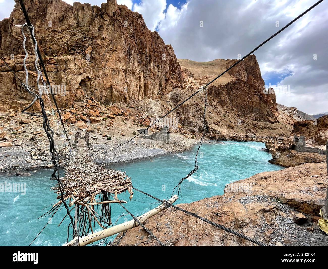 A flowing river surrounded by rocky Ladakh & Zanskar mountains Stock ...