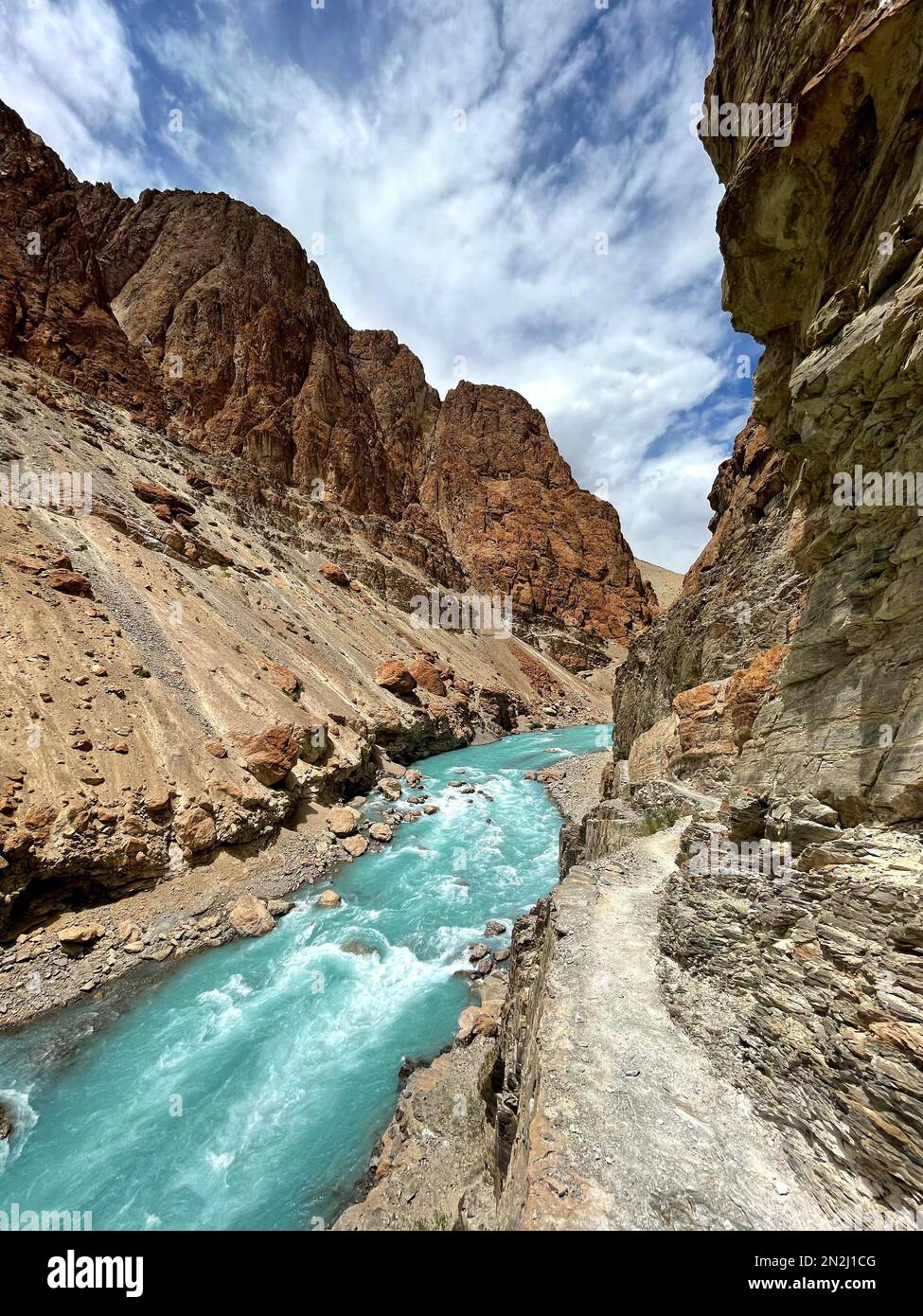 A flowing river surrounded by rocky Ladakh & Zanskar mountains Stock ...