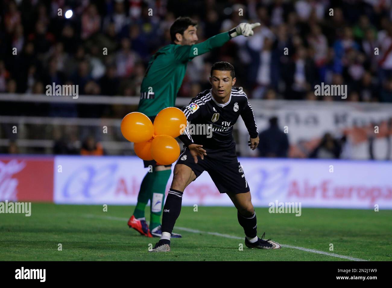 Real's Cristiano Ronaldo pushes balloons out of the field during a ...