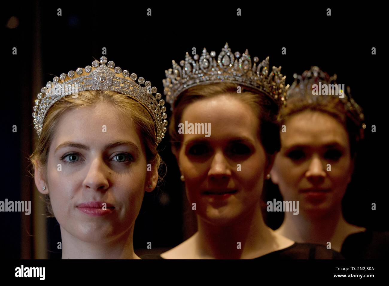 Employee's of Sotheby's auction house wear diamond tiaras from the ...