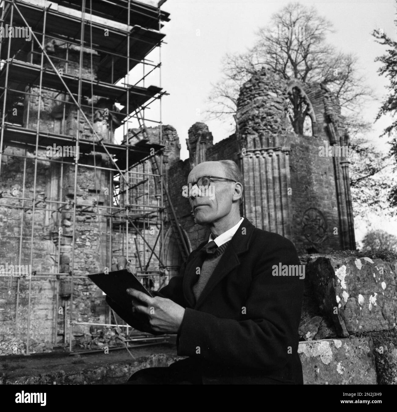 David Harmer is seen checking measurements for his model of the Old ...