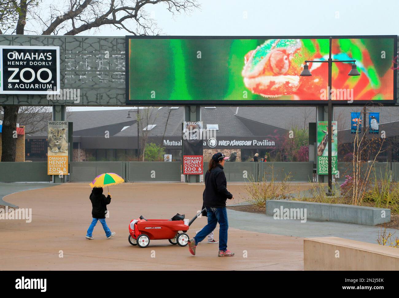 Visitors walk to the entrance of the Henry Doorly Zoo in Omaha, Neb ...