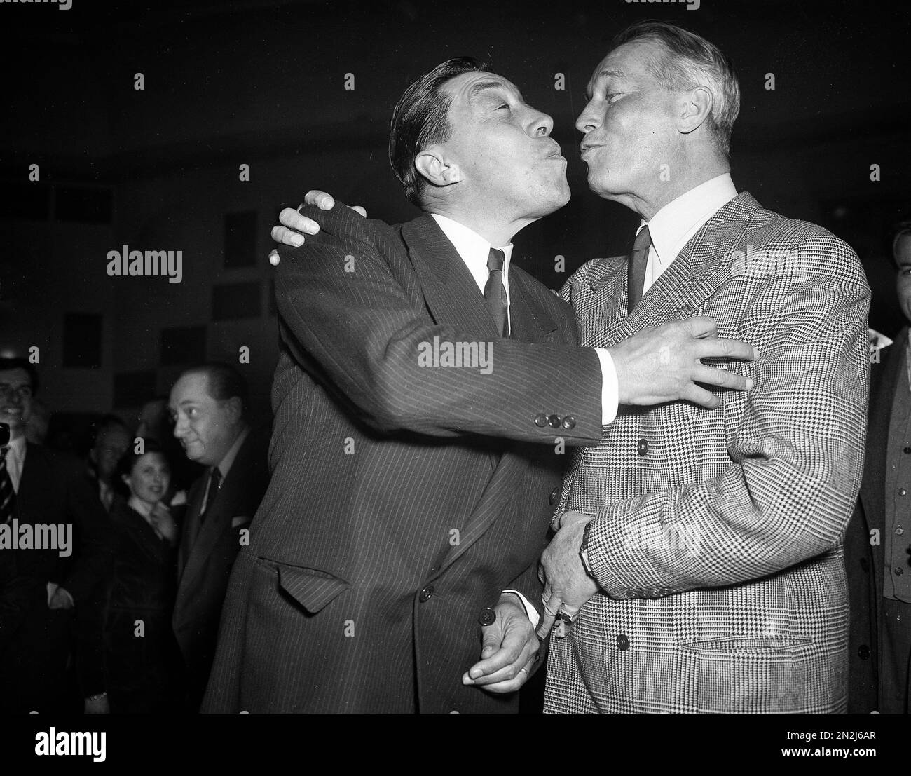 French singer Maurice Chevalier, right, congratulates famous French ...