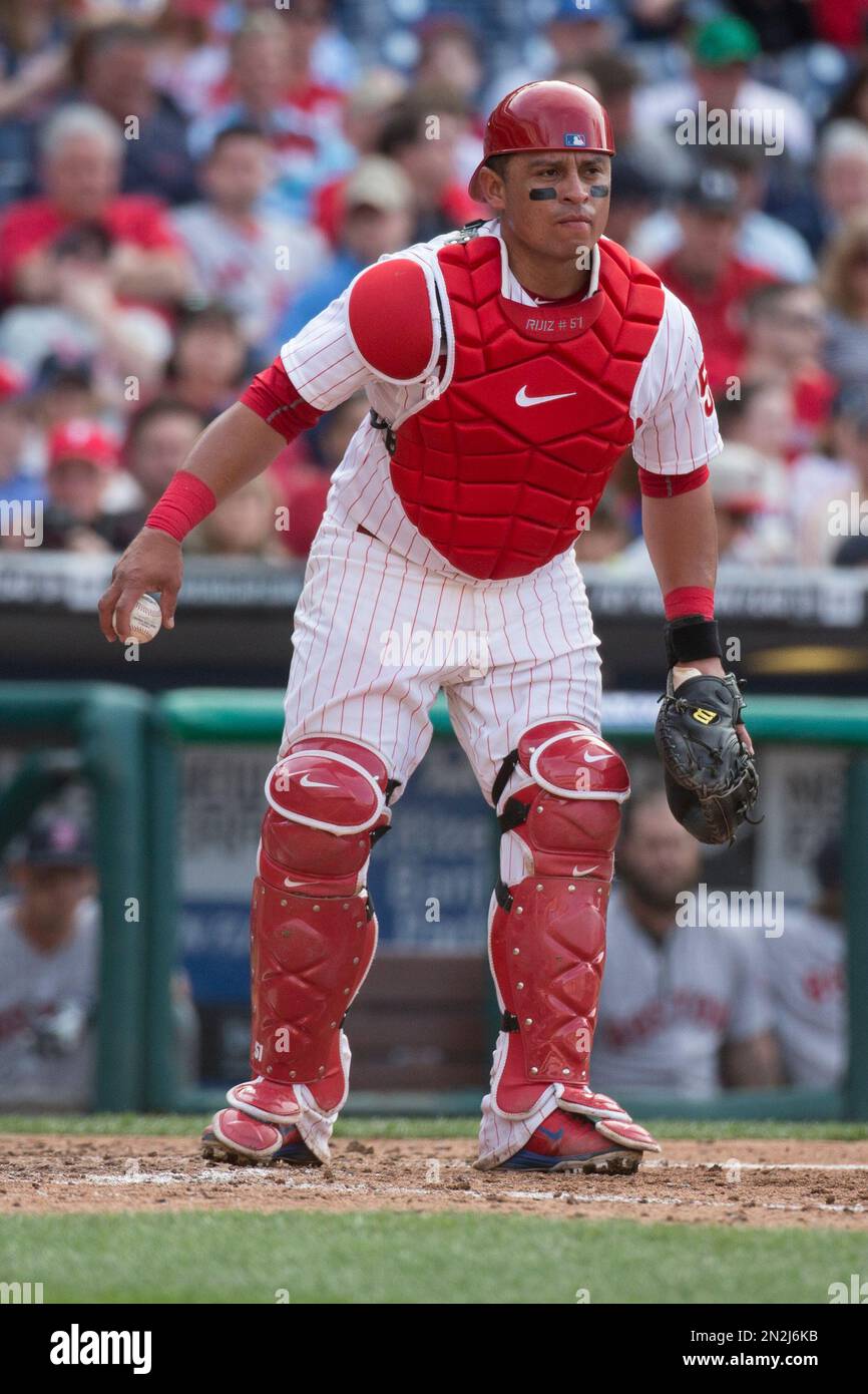 Philadelphia Phillies catcher Carlos Ruiz looks on with his mask off ...
