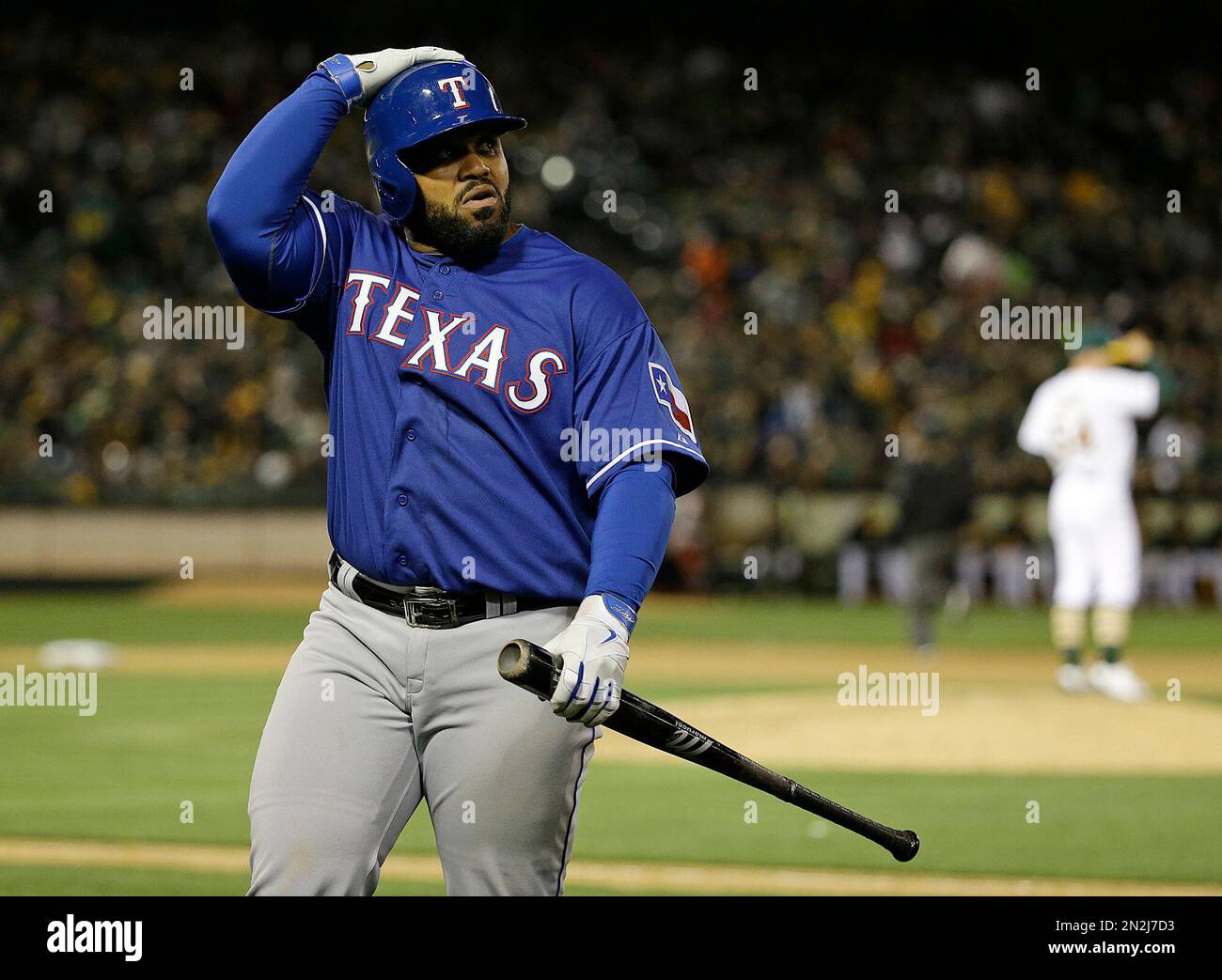 Texas Rangers' Prince Fielder walks back to the dugout after lining out ...