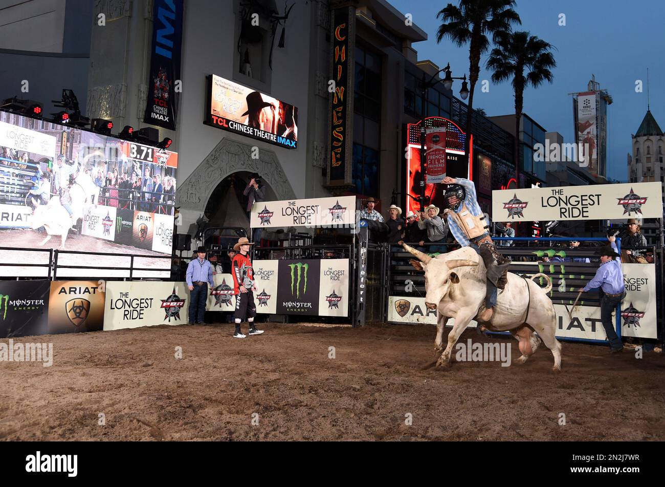 A professional bull rider participates in a bull riding exhibition at ...